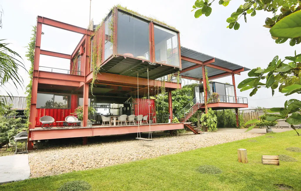 Breezy Shipping Container House is Wealthy in Glass and Greenery ...