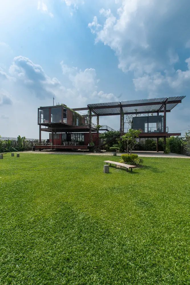 Breezy Shipping Container House is Wealthy in Glass and Greenery ...