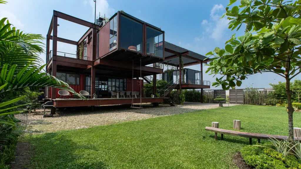 Breezy Shipping Container House is Wealthy in Glass and Greenery ...