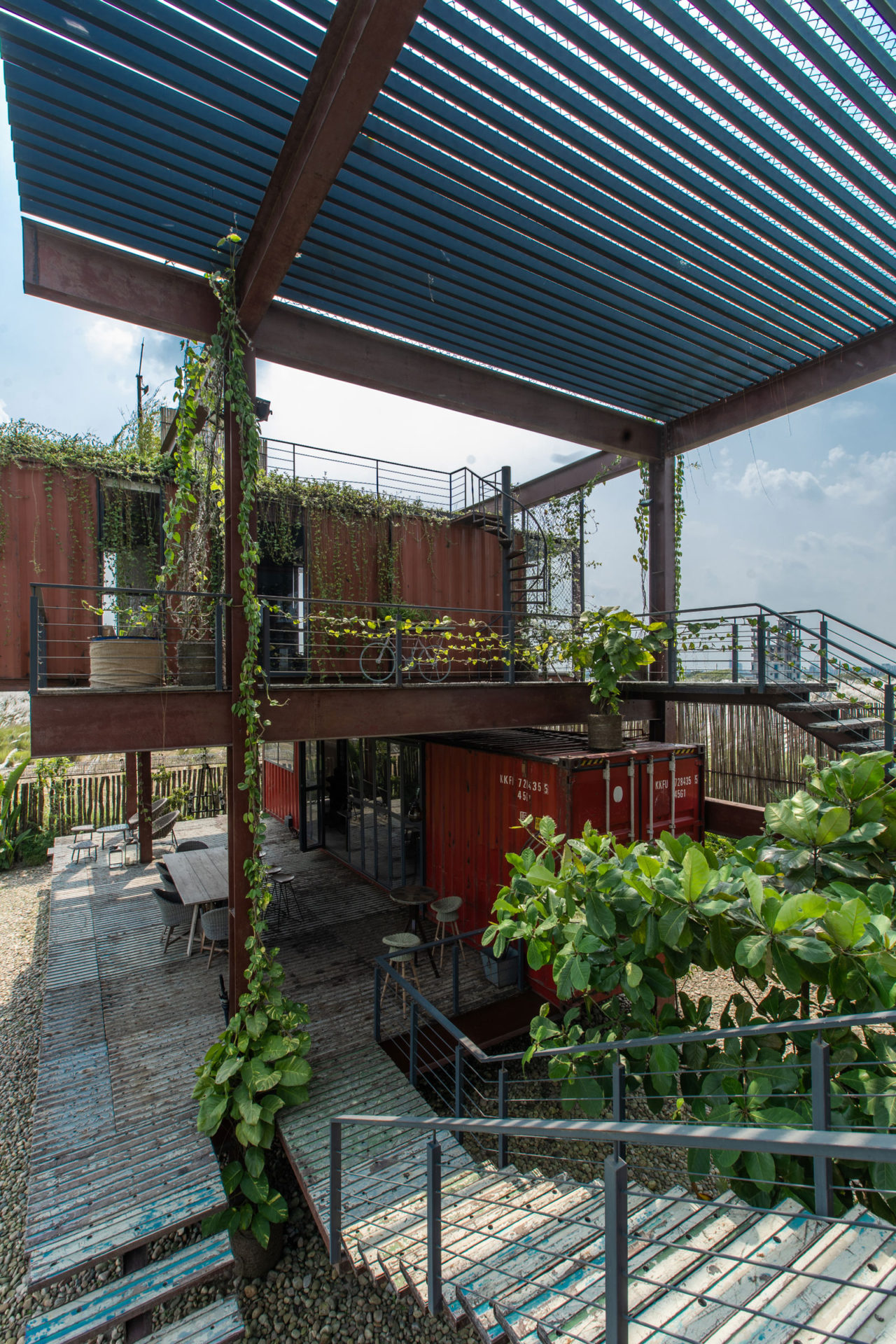 Breezy Shipping Container House is Wealthy in Glass and Greenery ...