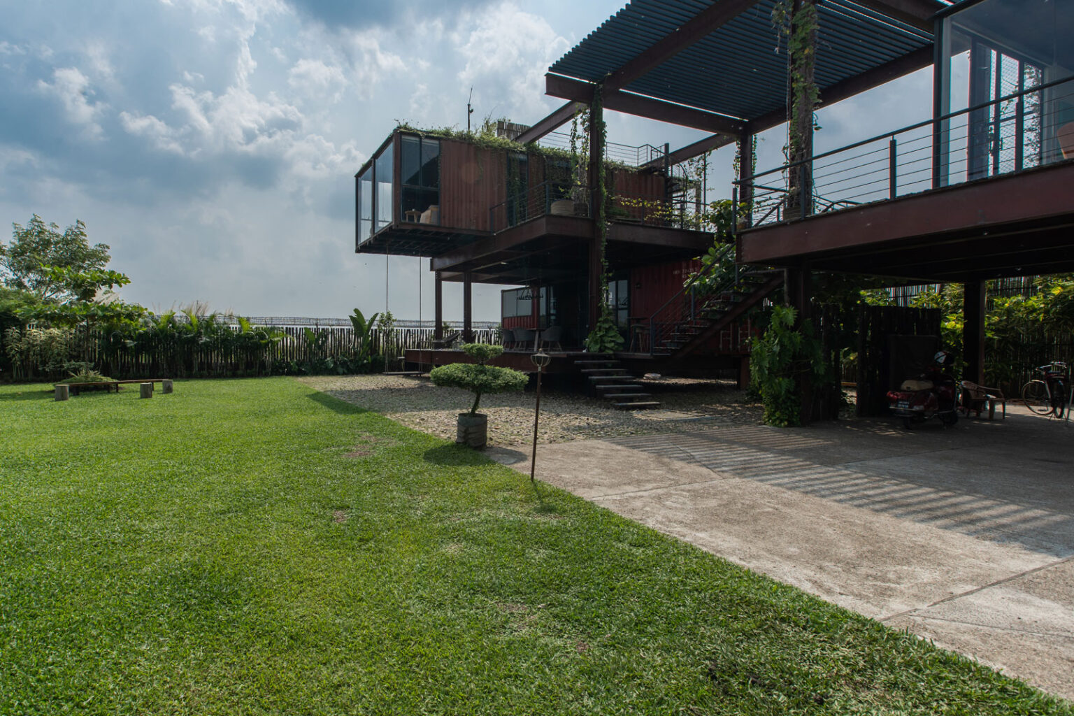 Breezy Shipping Container House is Wealthy in Glass and Greenery ...