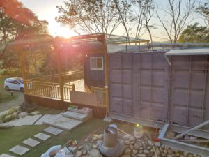 L-Shaped Container House with Amazing Veranda