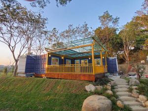 L-Shaped Container House with Amazing Veranda
