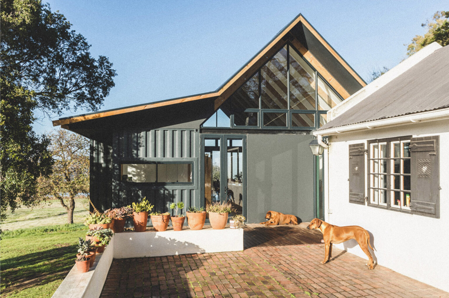 Modern Shipping Container House Connected with Existing Cottage