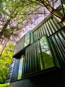 Shipping Container Home in Center of Trees