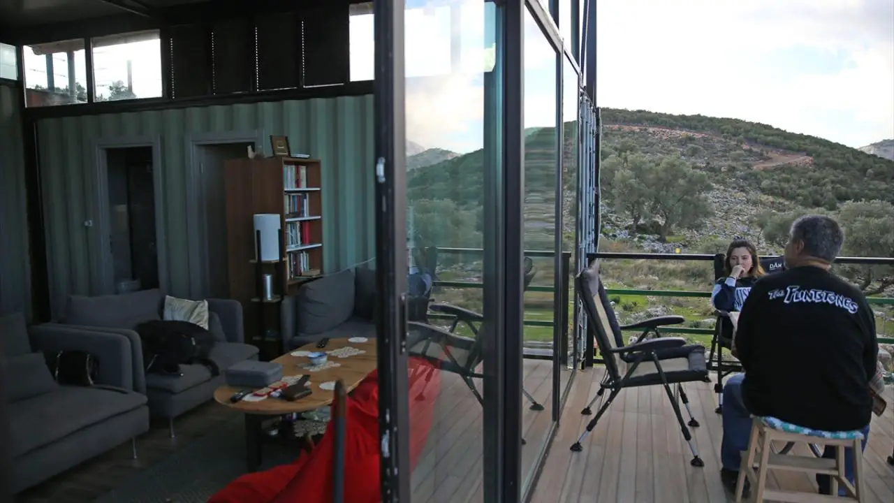 Sustainable Living in a Compact Container Home Fueled by the Sun and Wind